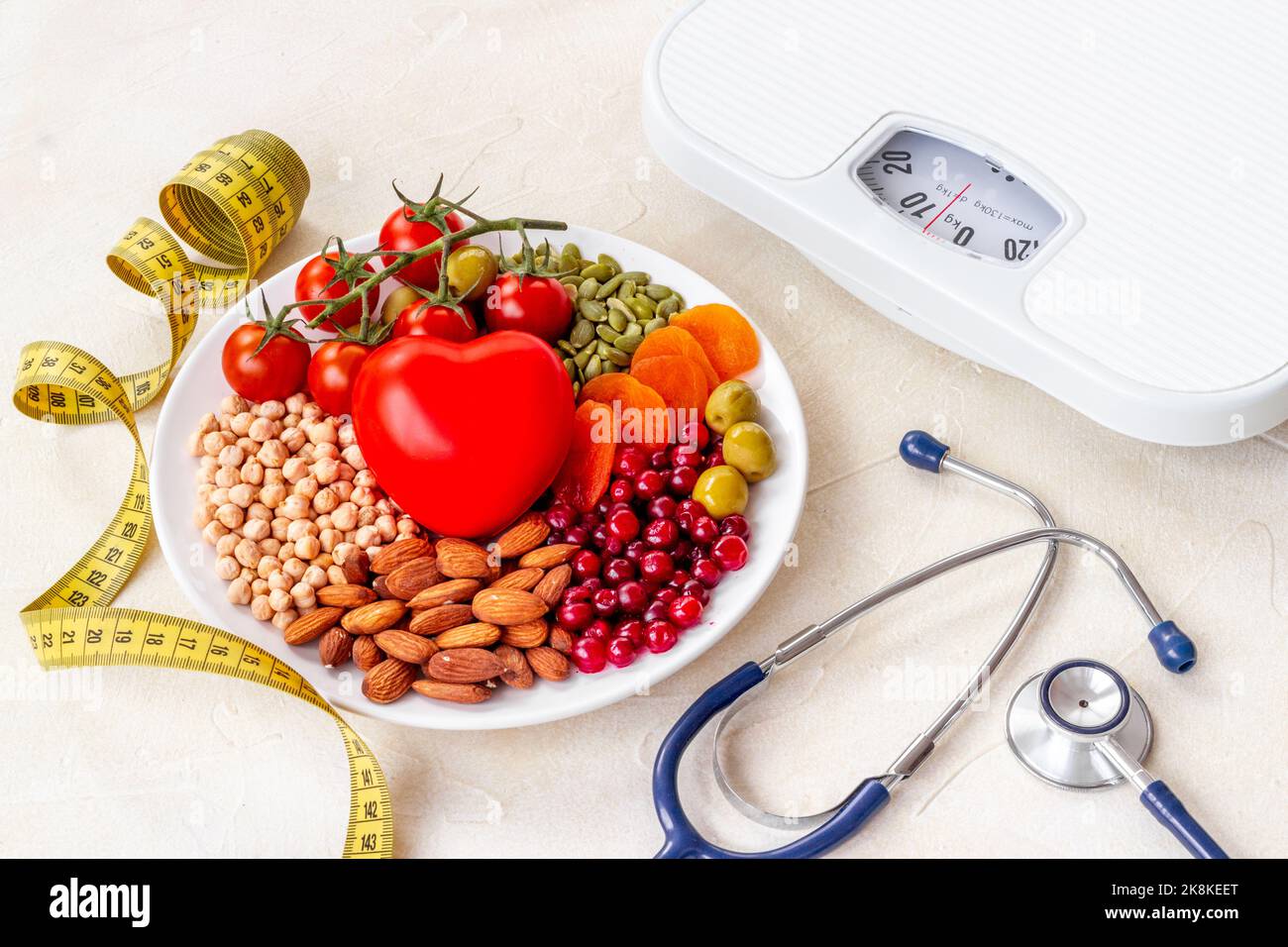 Heart shaped dish of fruits and healthy food with weight scale Stock ...