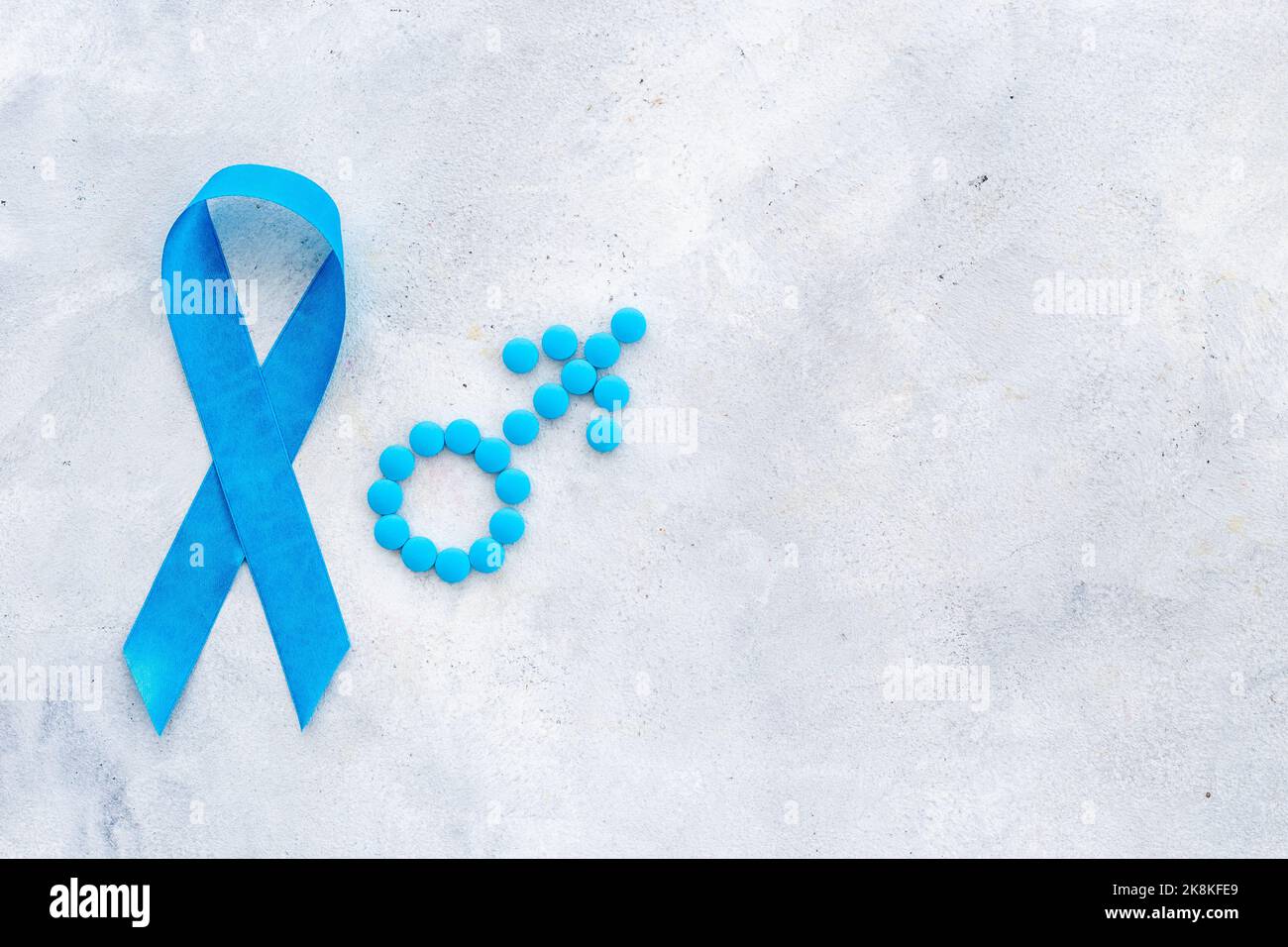 Blue ribbon symbol of prostate cancer with male sign of blue pills ...