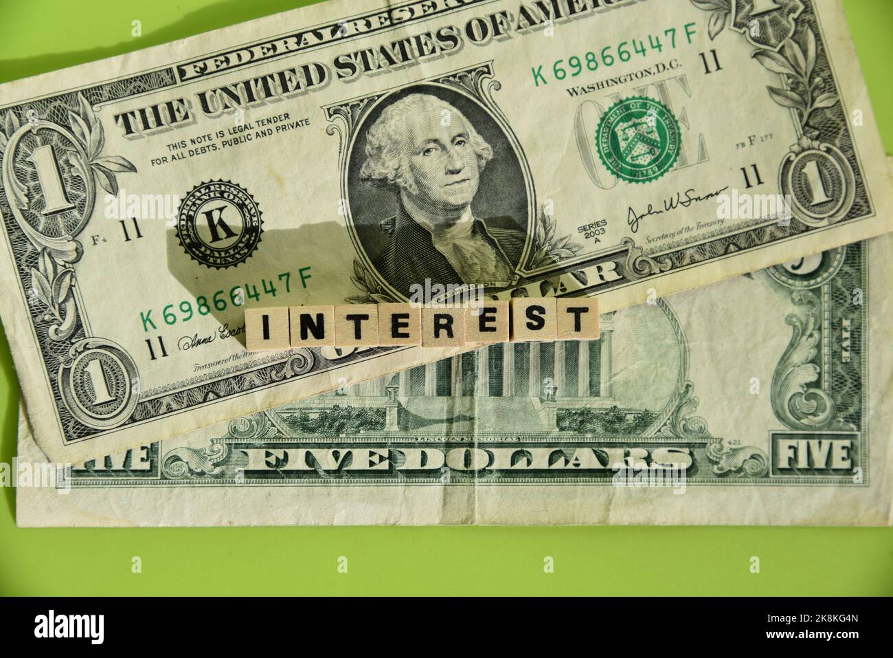 Interest and dollar bank notes Stock Photo - Alamy