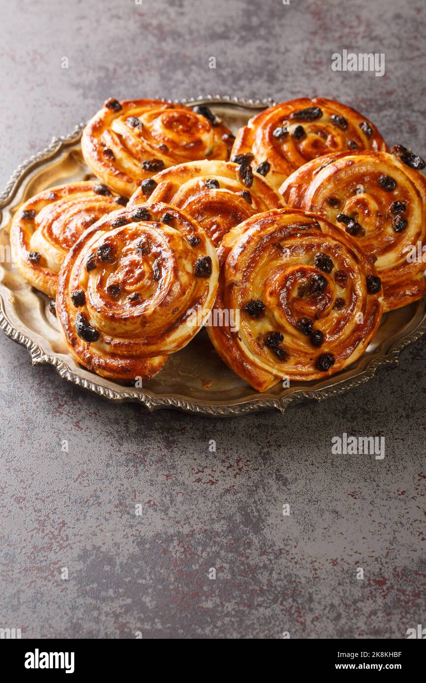 Pain aux Raisins, Danish raisin pastry swirls closeup in the plate on ...