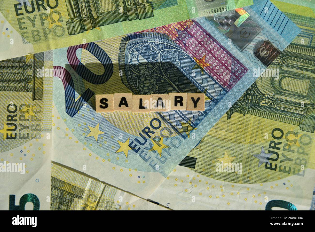 Salary and dollar bank notes Stock Photo - Alamy