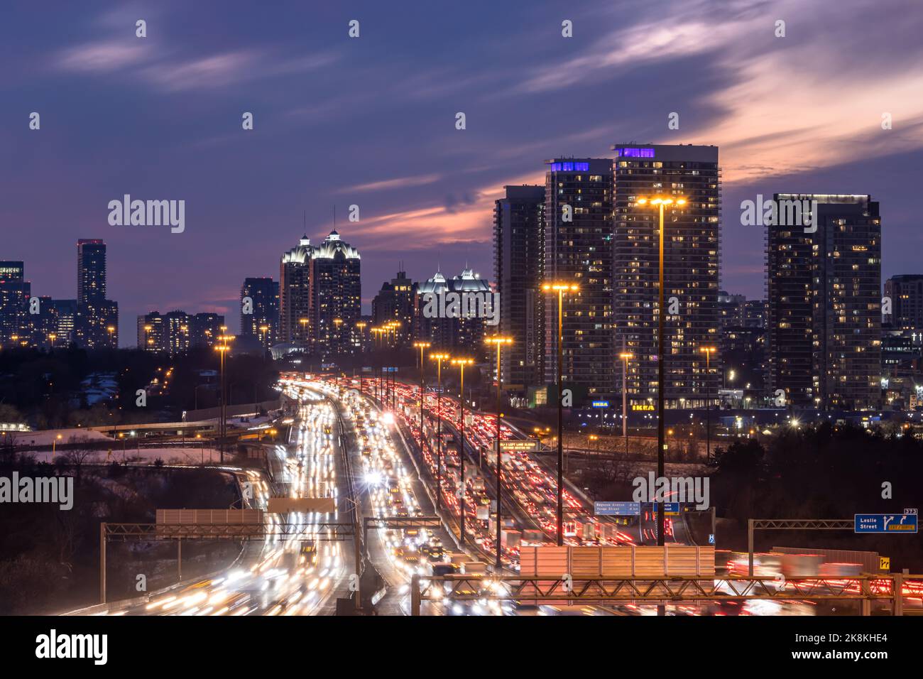 An aerial view of cityscape Toronto surrounded by buildings in night ...