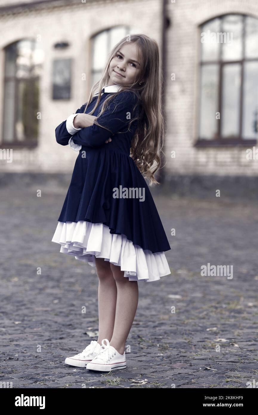 Developing sense of style. Small kid wear uniform outdoors. Back to ...