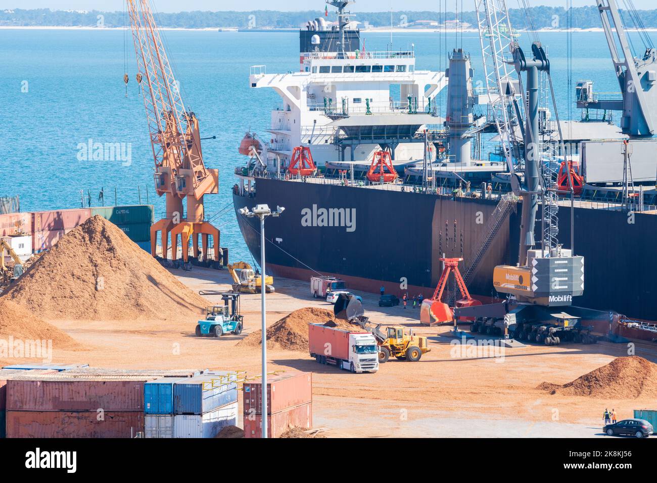 An aerial view of boat in the process of unloading wood chips carrier ...