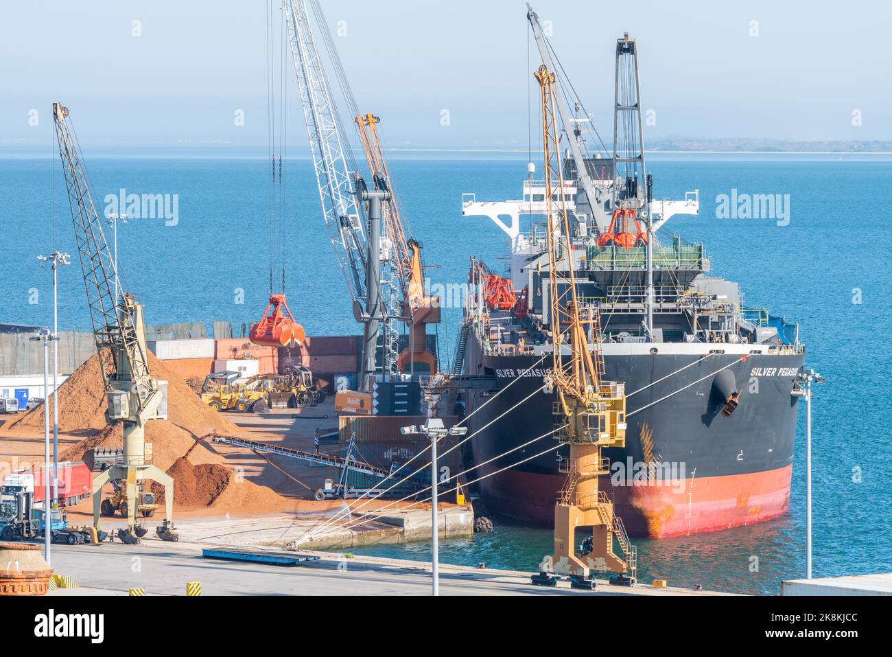 An aerial view of boat in the process of unloading wood chips carrier ...