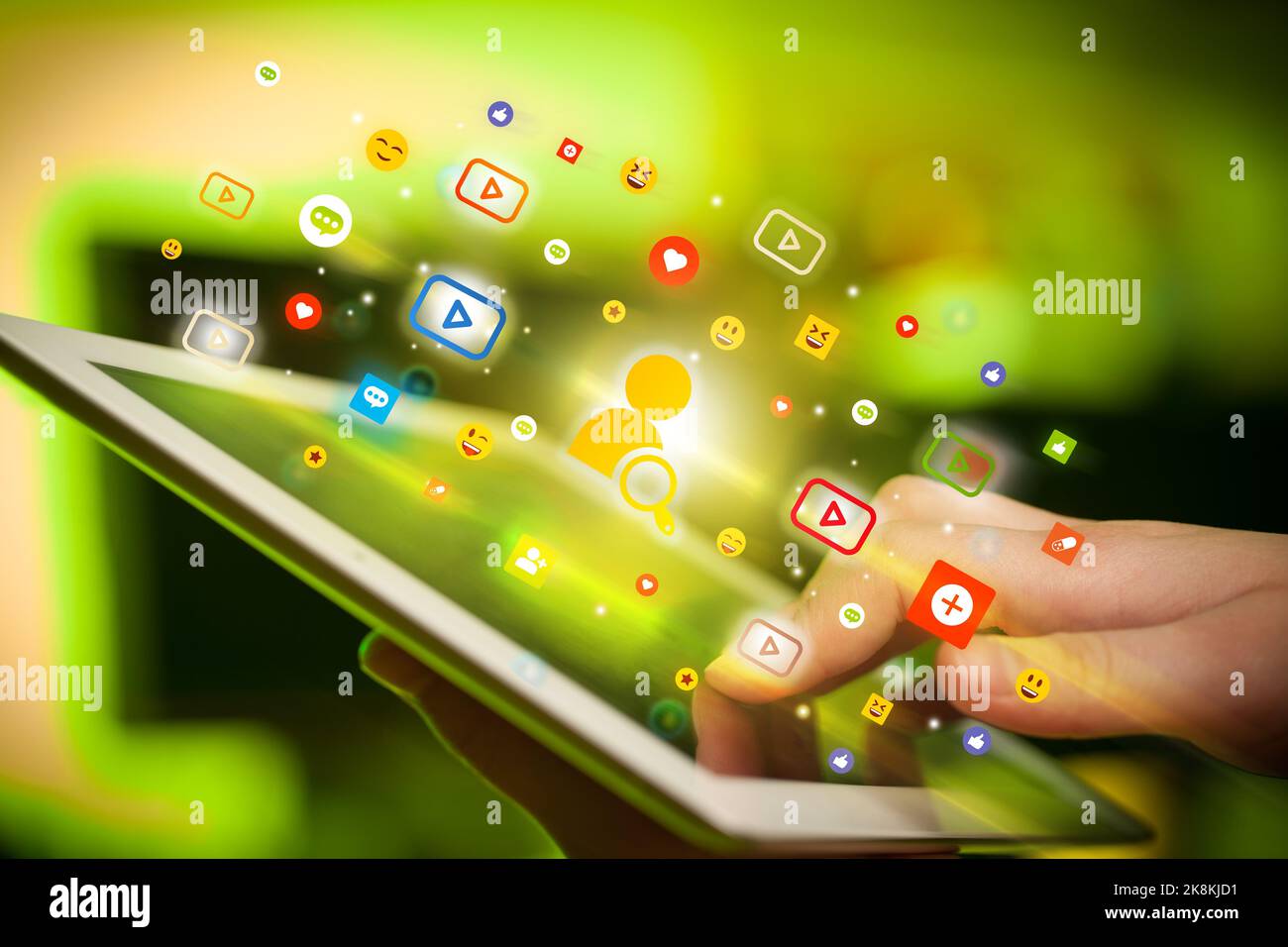 Close-up of a hand using tablet with social media icons Stock Photo - Alamy