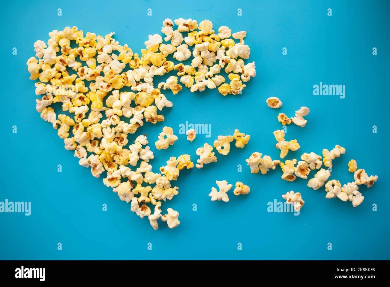 Food. Image of the Heart Forms from Popcorn. Delicious Popcorn on Blue ...