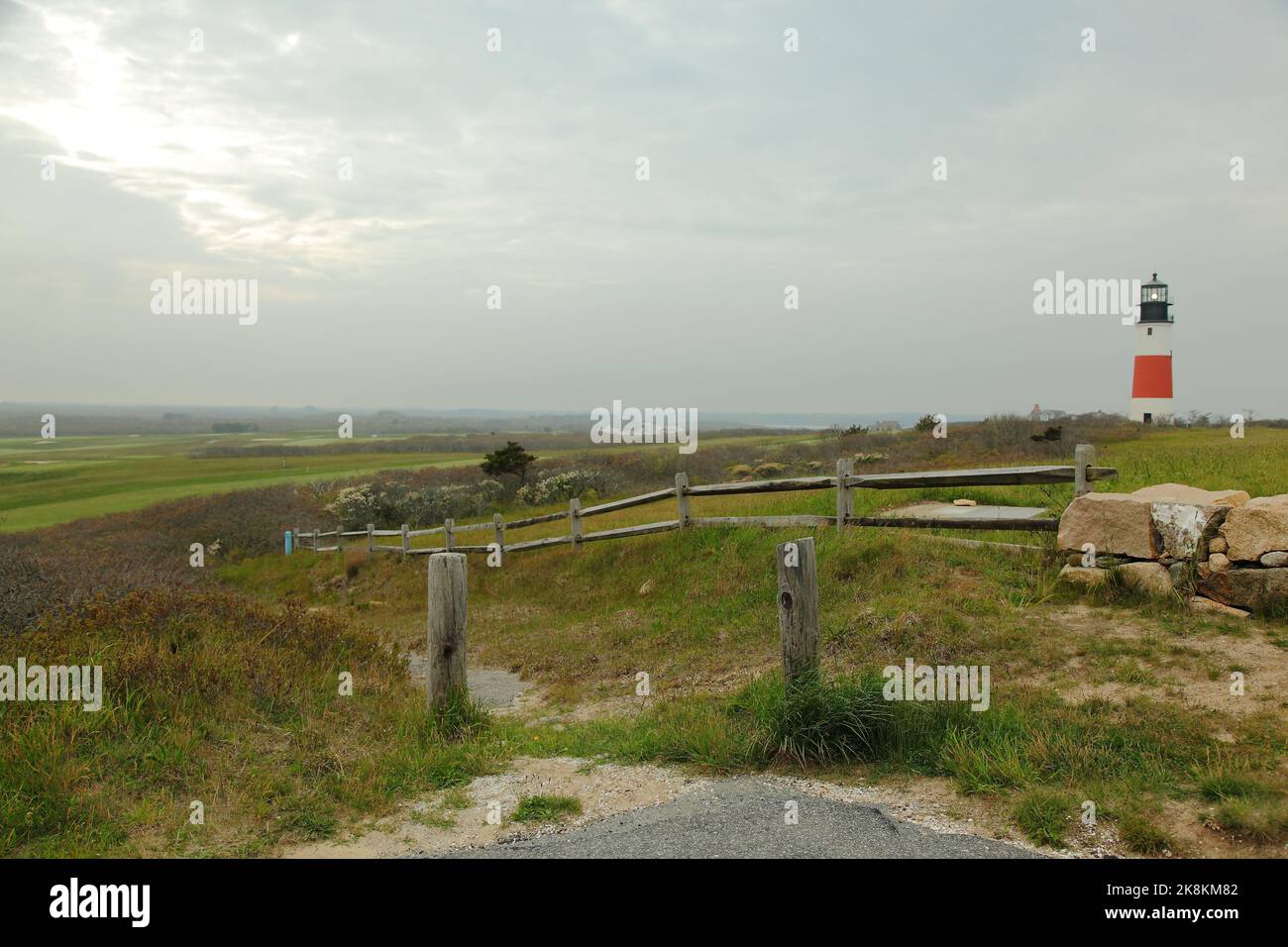 The Sankaty Head Lighthouse in green field at a distance in Siasconset ...