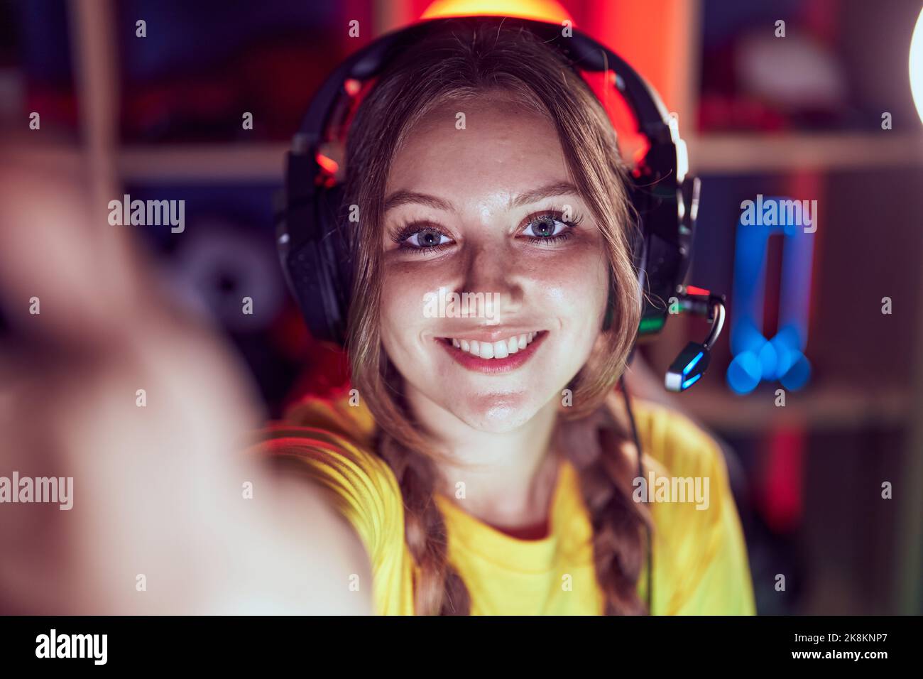 Young blonde woman streamer smiling confident make selfie by camera at ...