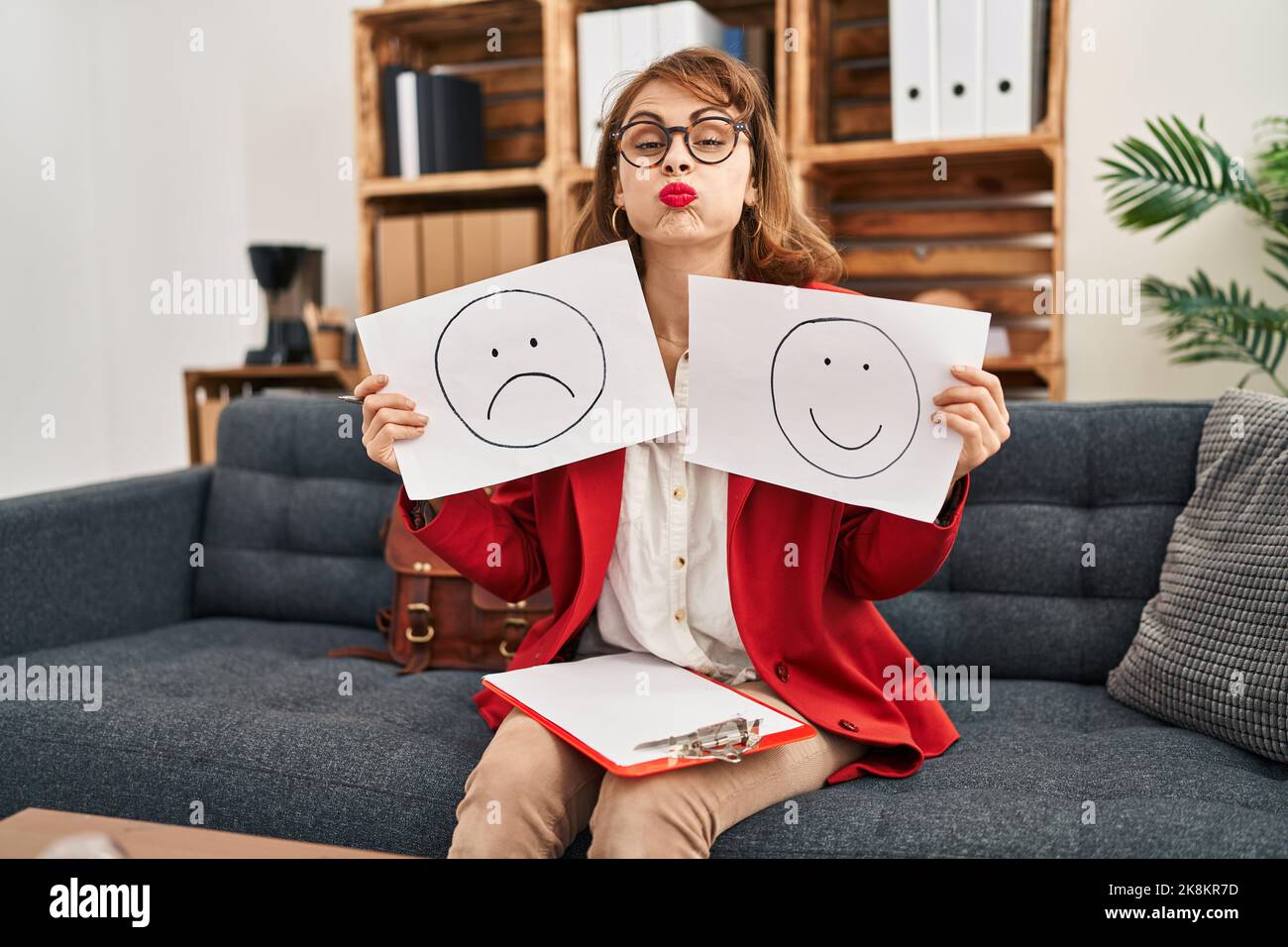 Young beautiful woman working on depression holding sad to happy ...