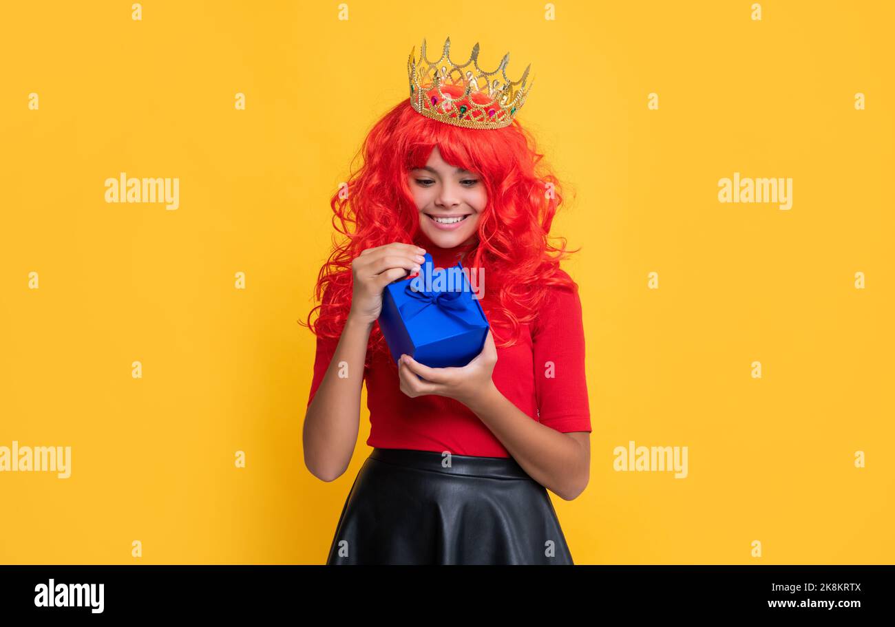 smiling queen crown in crown with present box on yellow background ...