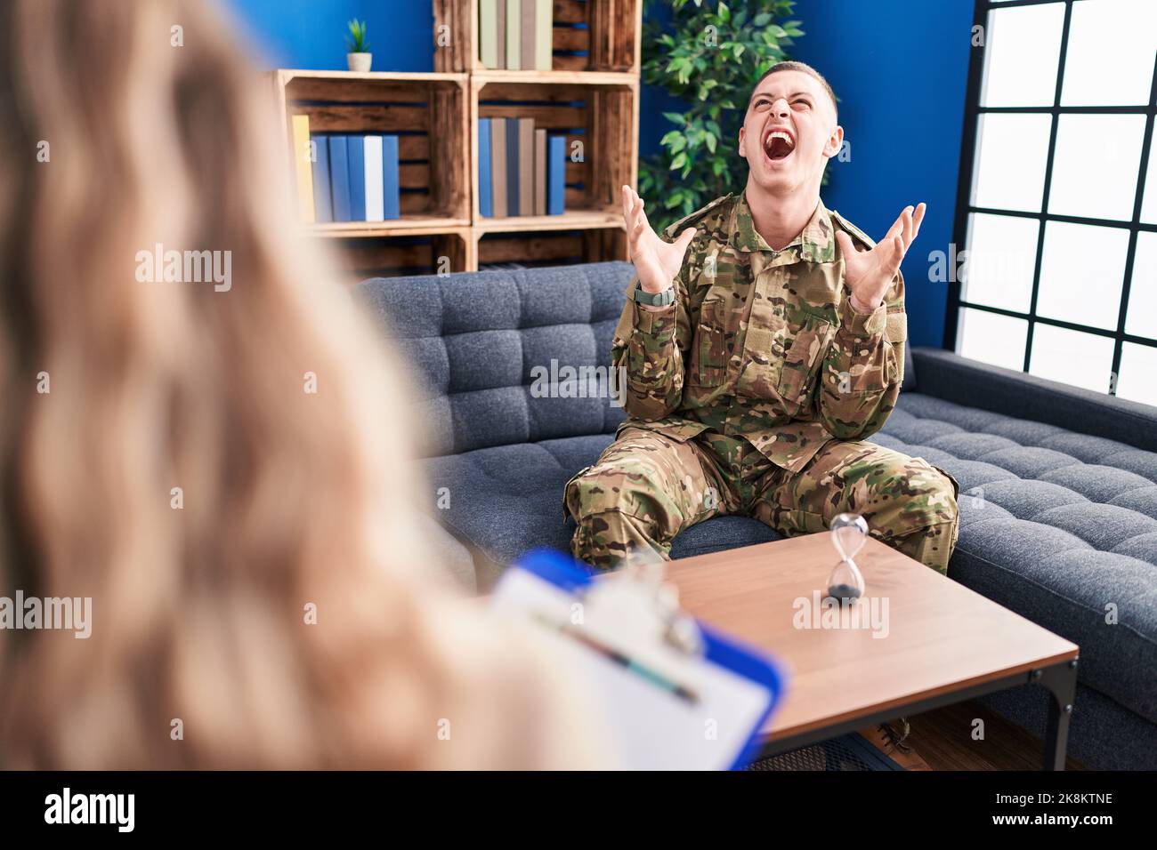 Young man doing therapy after war crazy and mad shouting and yelling ...