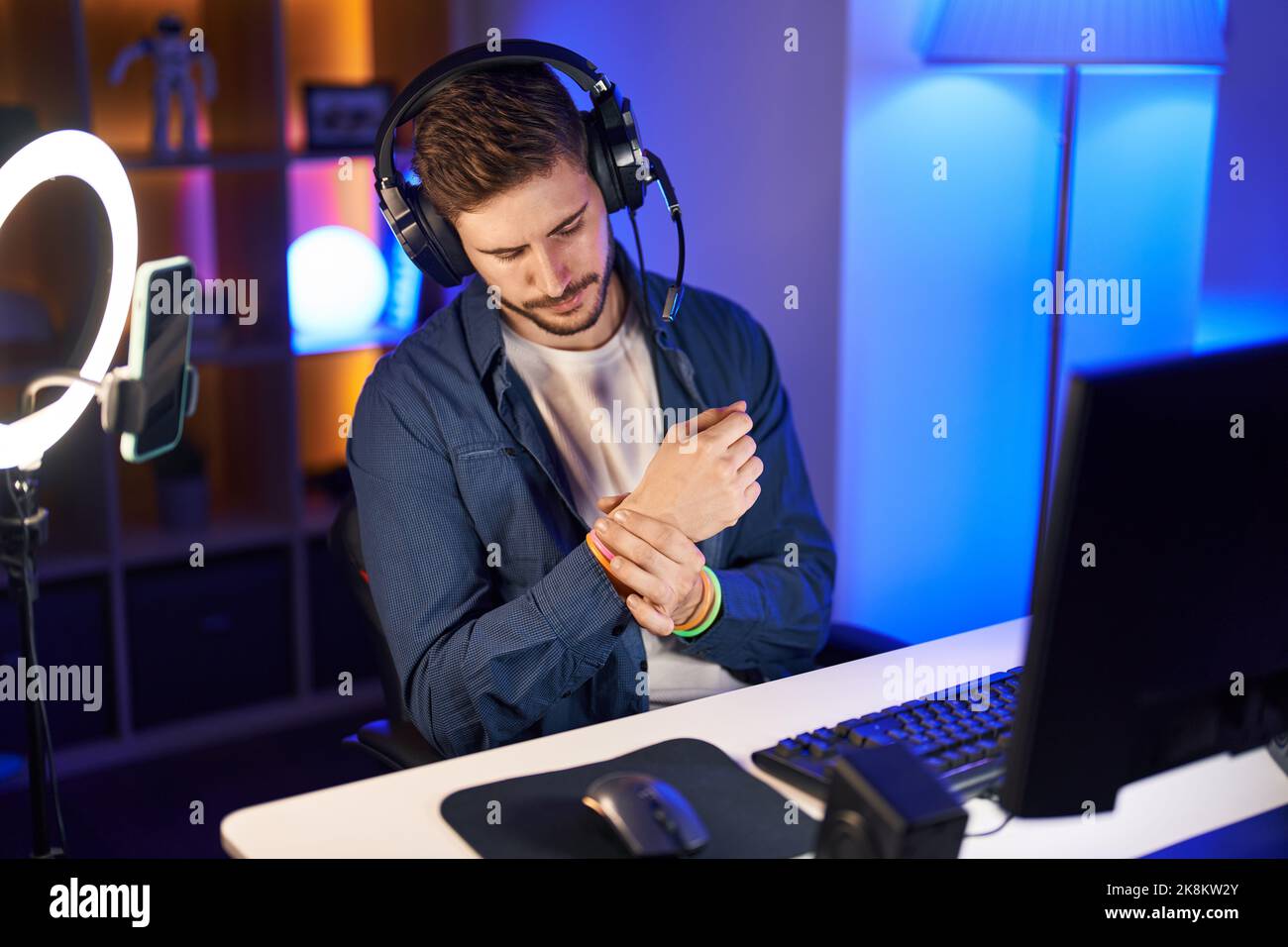 Young caucasian man streamer stressed using computer at gaming room ...