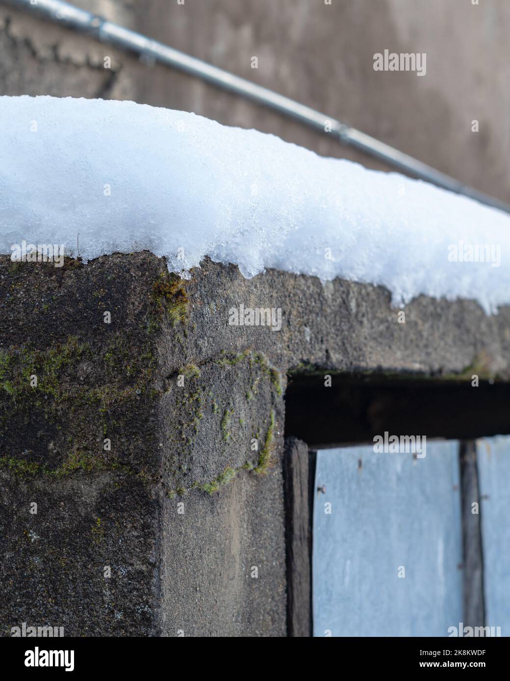 A concrete wall covered with snow Stock Photo - Alamy