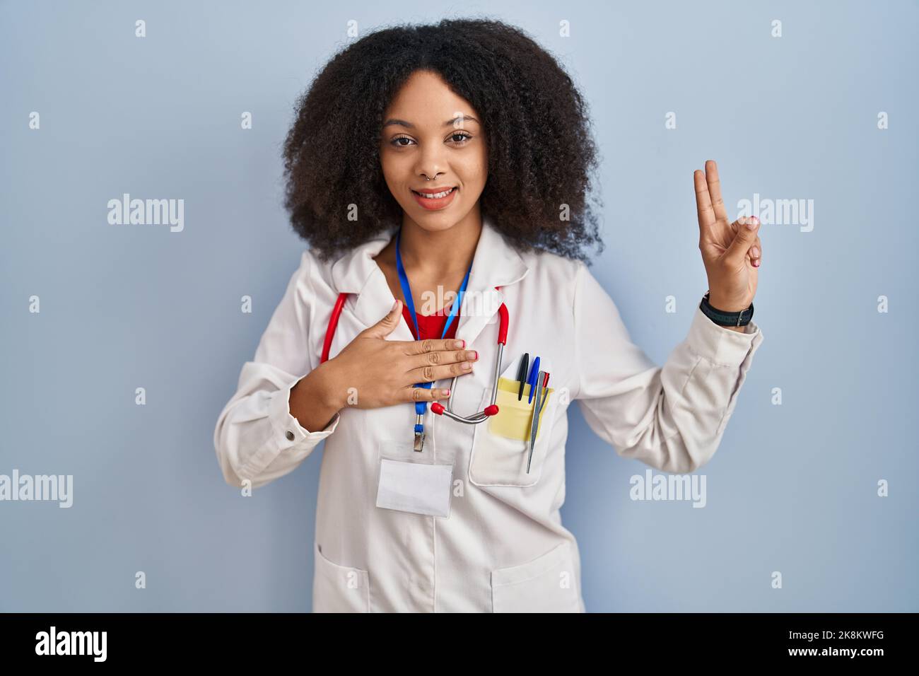 Young african american woman wearing doctor uniform and stethoscope ...