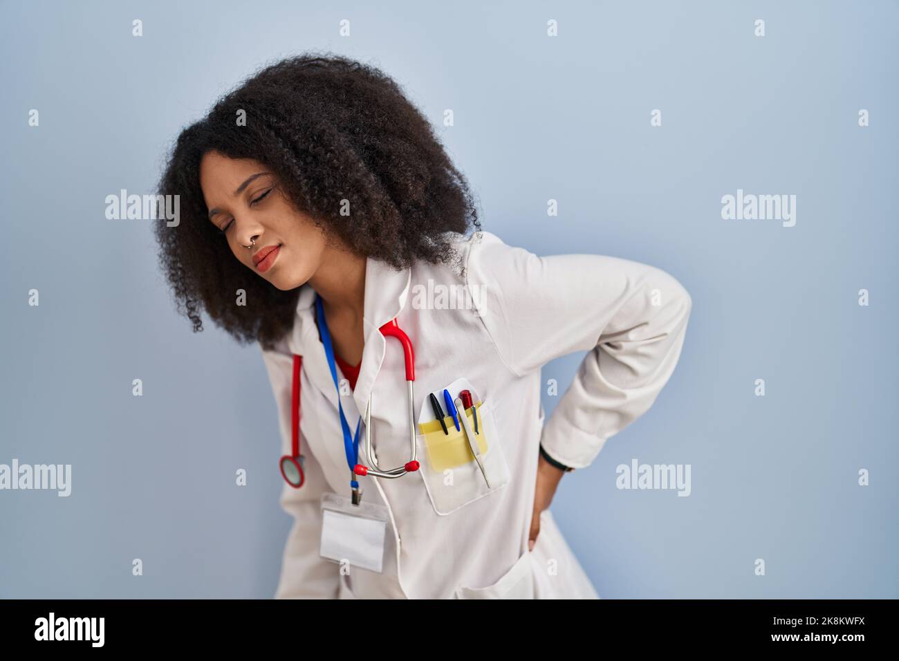 Young african american woman wearing doctor uniform and stethoscope ...