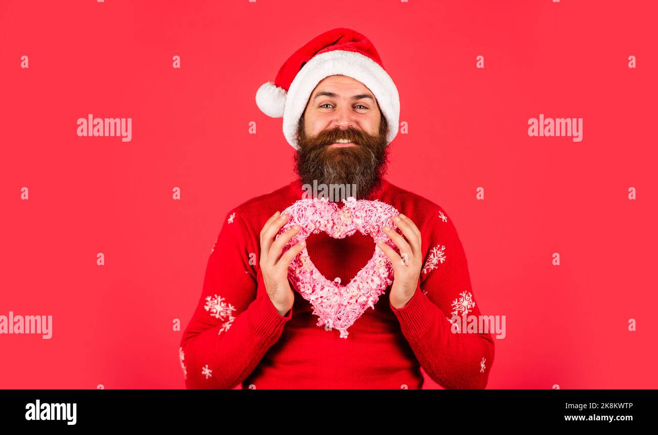 Handsome man love winter holidays red background. Merry christmas and ...