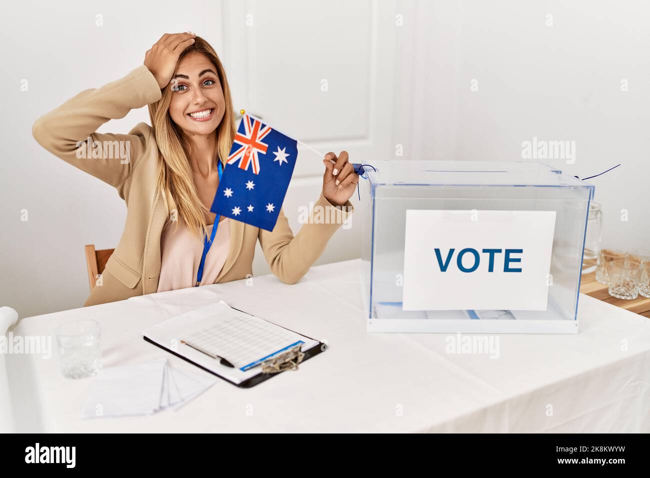 Blonde beautiful young woman at political campaign holding australian ...
