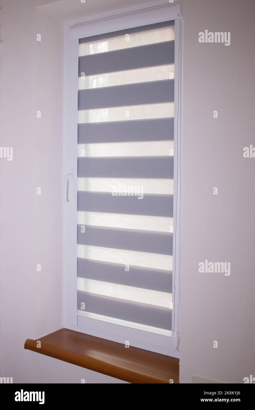Window roller duo system day and night. Close up on roll curtains ...