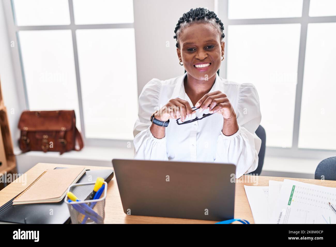 African american woman business worker smiling confident holding ...