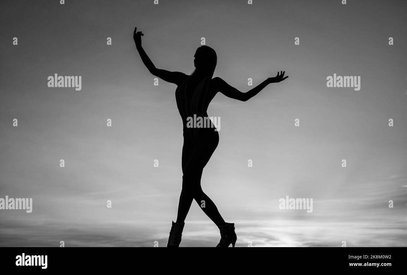 Rise of inspiration. Woman silhouette on evening sky. Inspirational ...