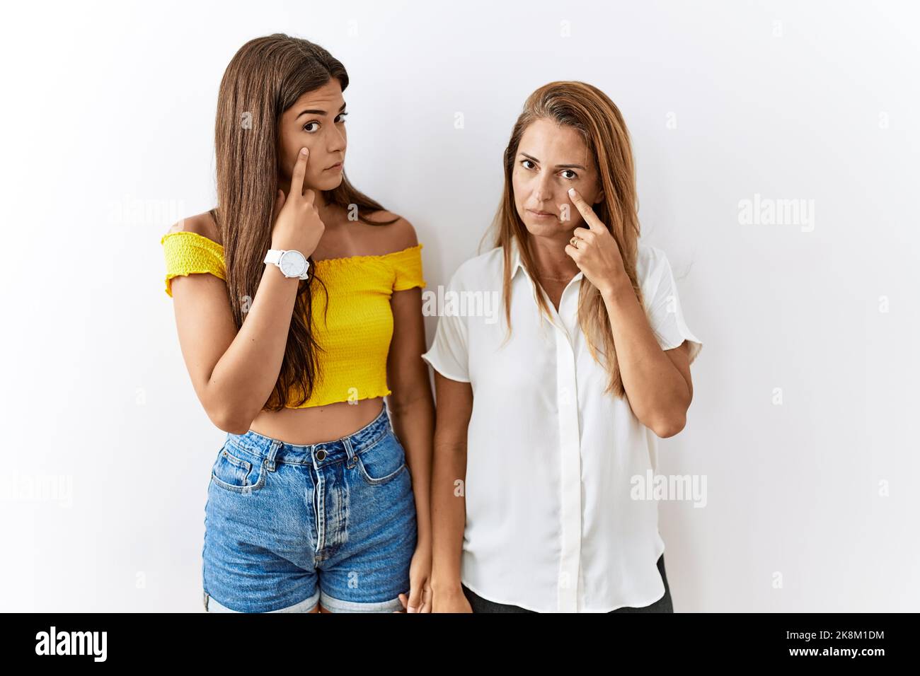 Mother And Daughter Together Standing Together Over Isolated Background