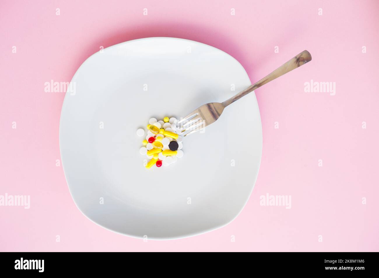 Close up of pills on plate. Dietary supplements. Variety pills. Vitamin ...