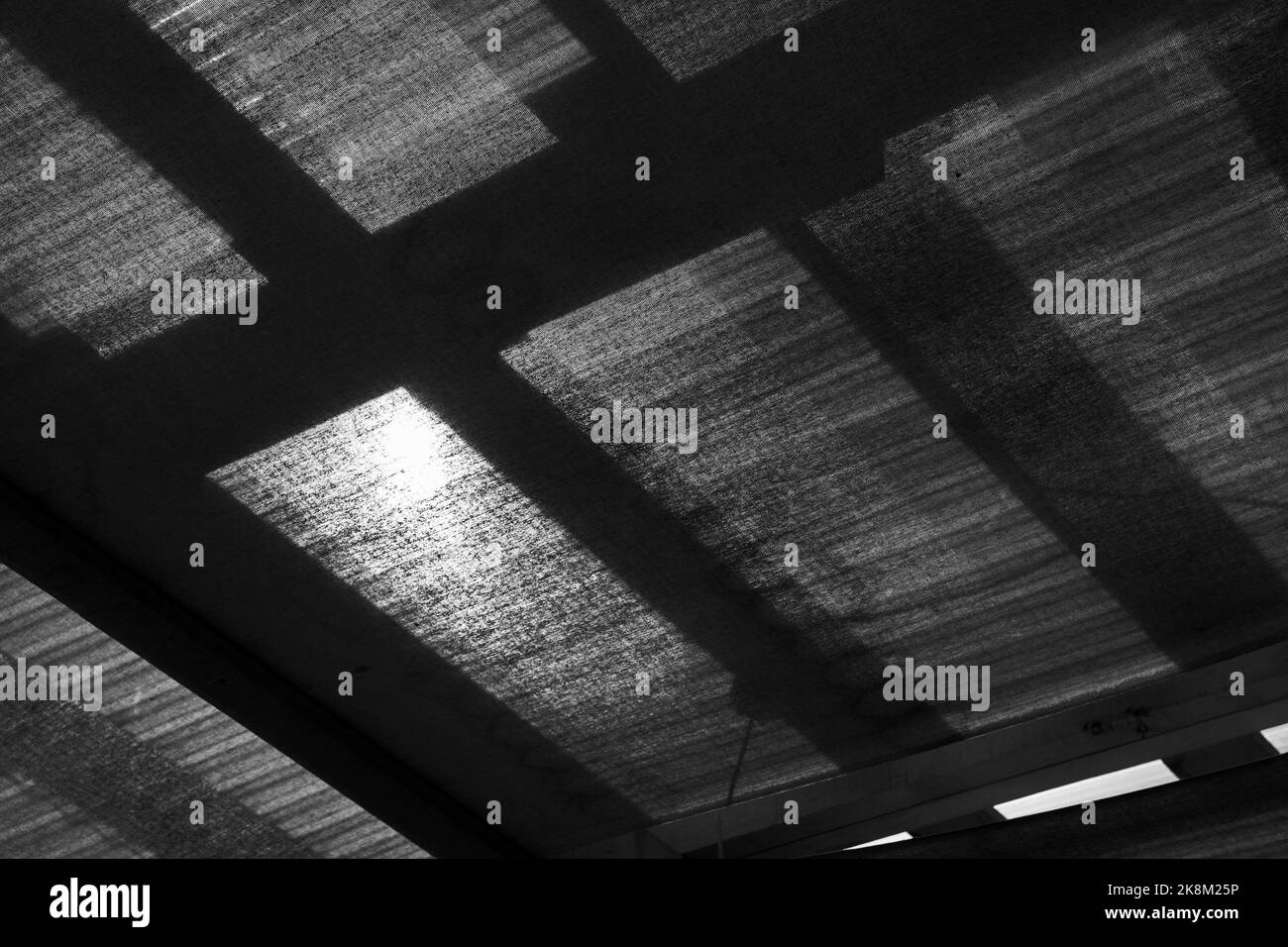 Abstract architecture background with dark sunshade under sunshine ...