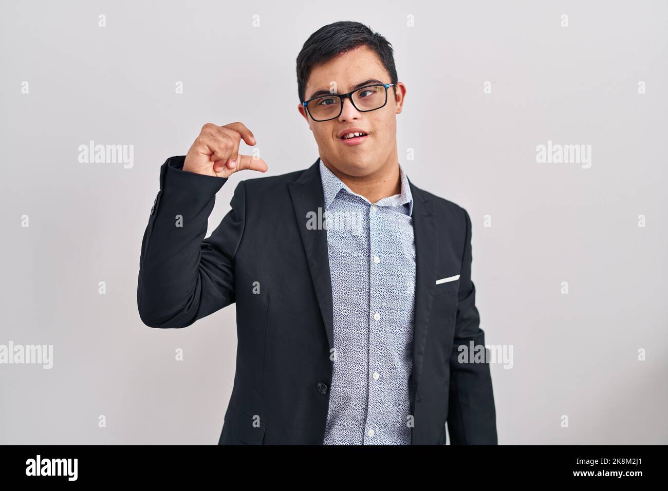 Young hispanic man with down syndrome wearing business style smiling ...