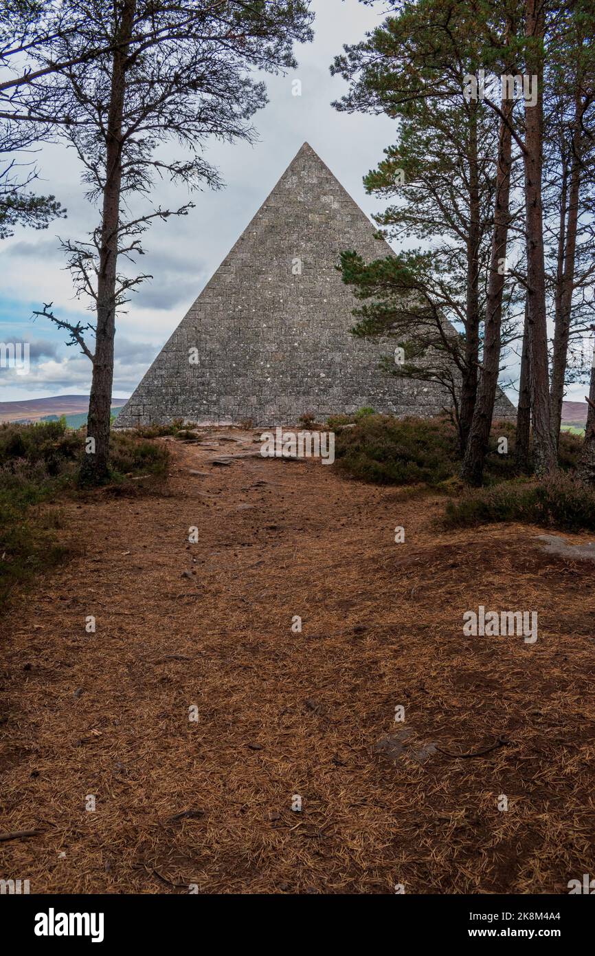 A pyramid building made with bricks with tall trees Stock Photo - Alamy