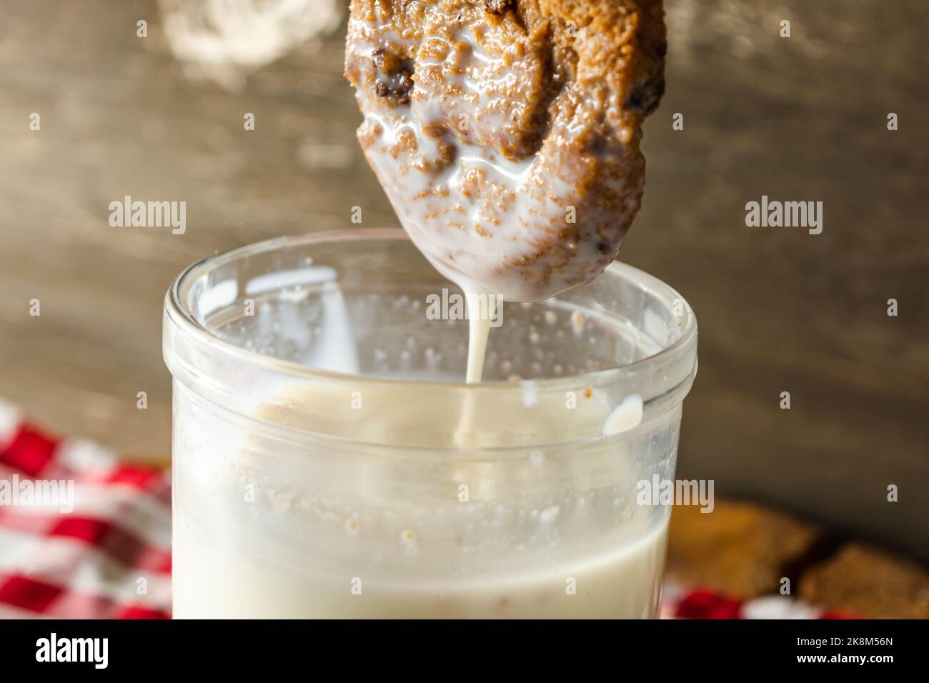 dipping or wetting a cookie, making a splash. morning breakfast concept ...