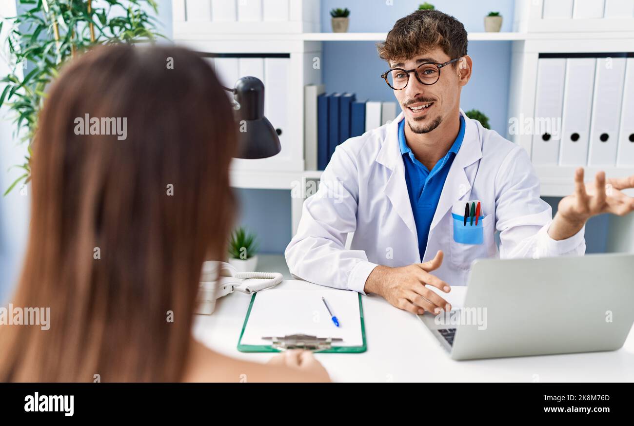 Man and woman wearing doctor uniform having medical consultation at ...