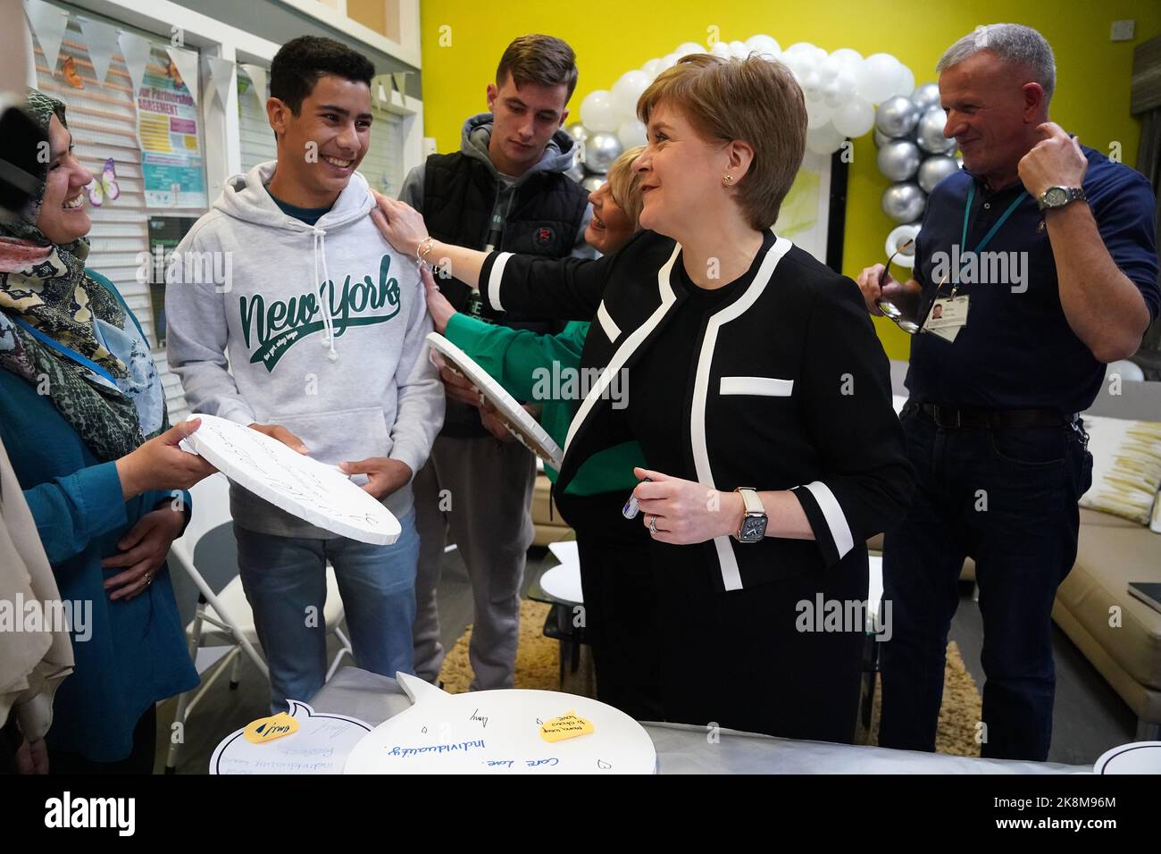 First Minister Nicola Sturgeon with young people and staff during her ...