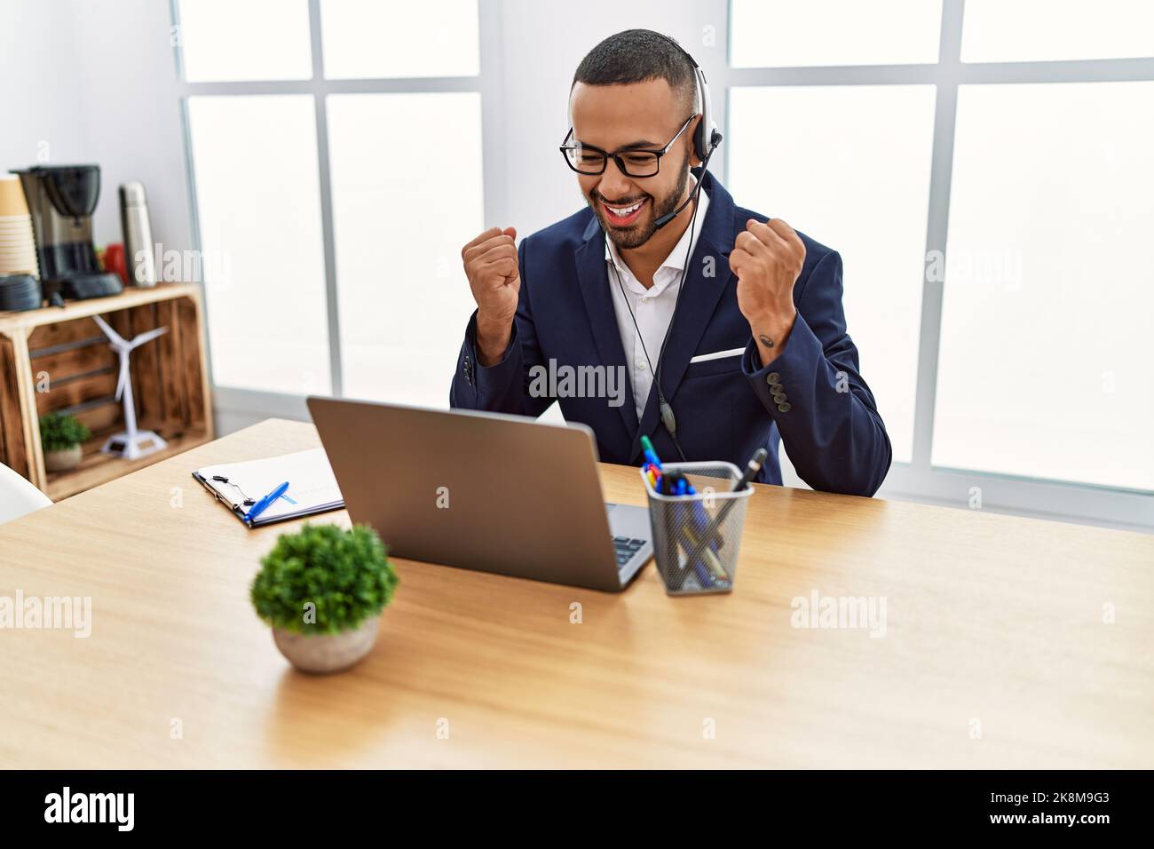 African american young man wearing call center agent headset at the ...