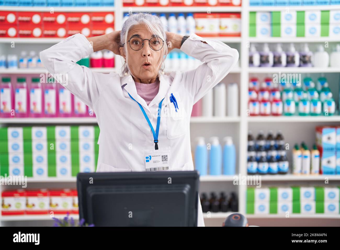 Middle age woman with tattoos working at pharmacy drugstore crazy and ...