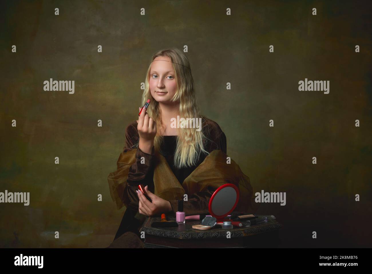 Beaty. Beautiful young girl as Mona Lisa picture using makeup brush ...