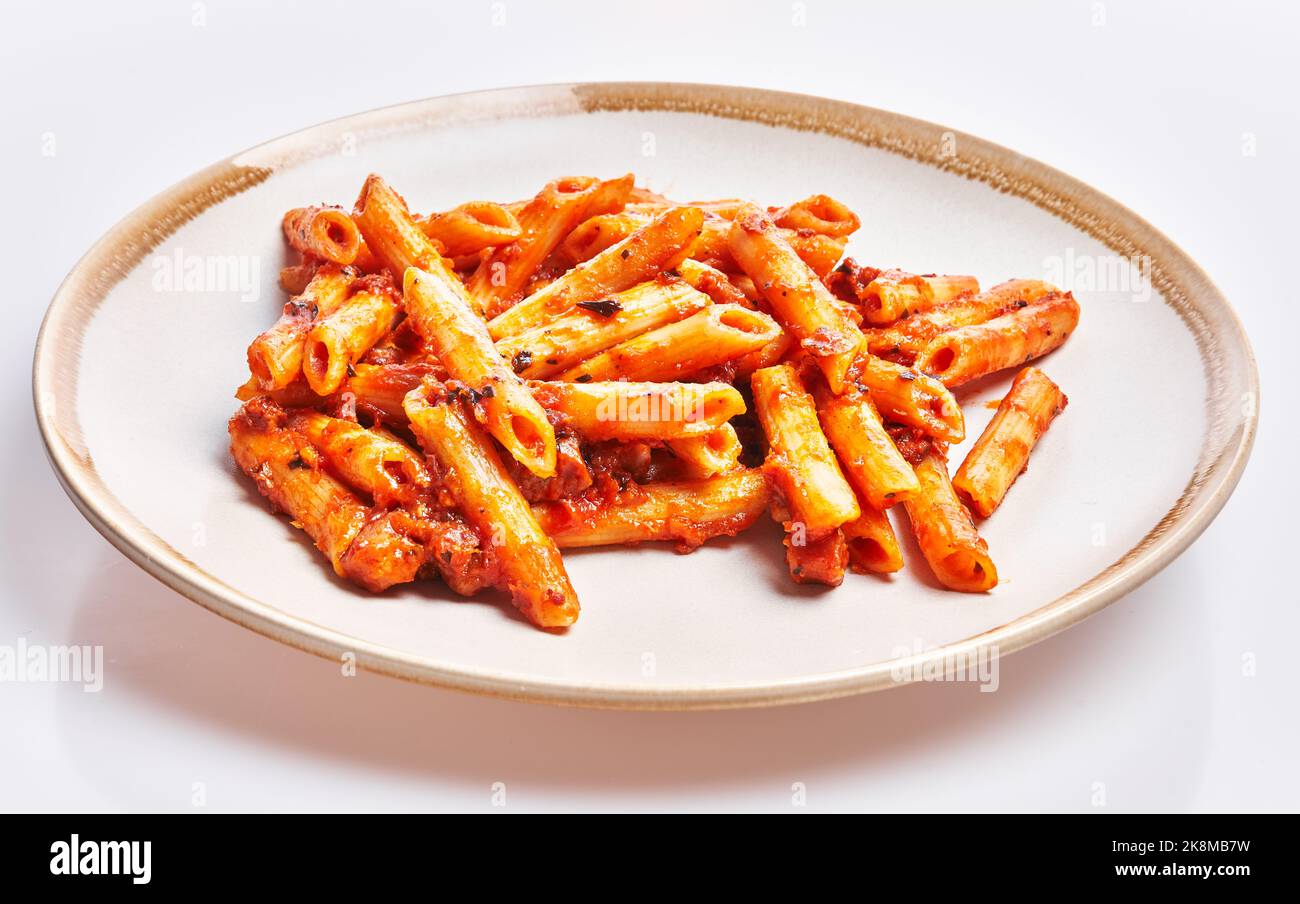 Delicious plate of italian macaroni with tomato sauce over isolated ...