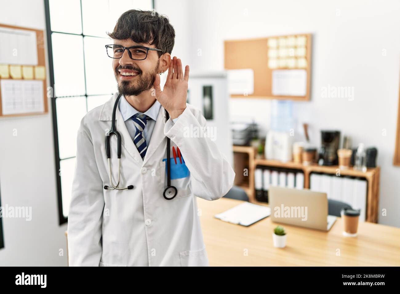 Hispanic man with beard wearing doctor uniform and stethoscope at the ...