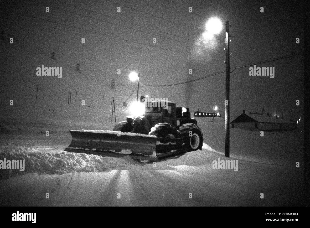 1969 Svalbard, Longyearbyen. A tractor gulls away snow in the polar ...