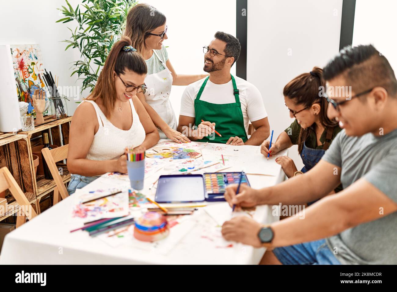 Group of draw students sitting on the table drawing at art studio Stock ...