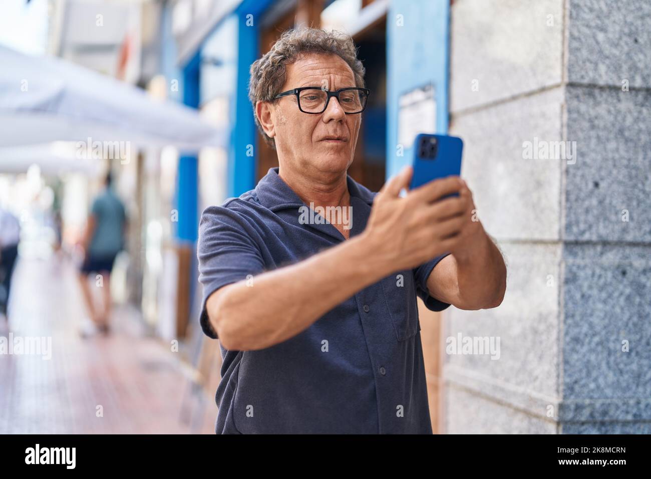 Middle age man making selfie by the smartphone at street Stock Photo ...