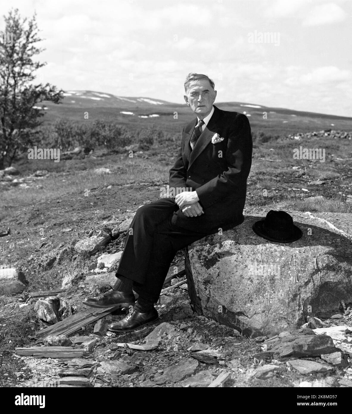 Røros 19490717 author Johan Falkberget, sitting on the cornerstone of ...
