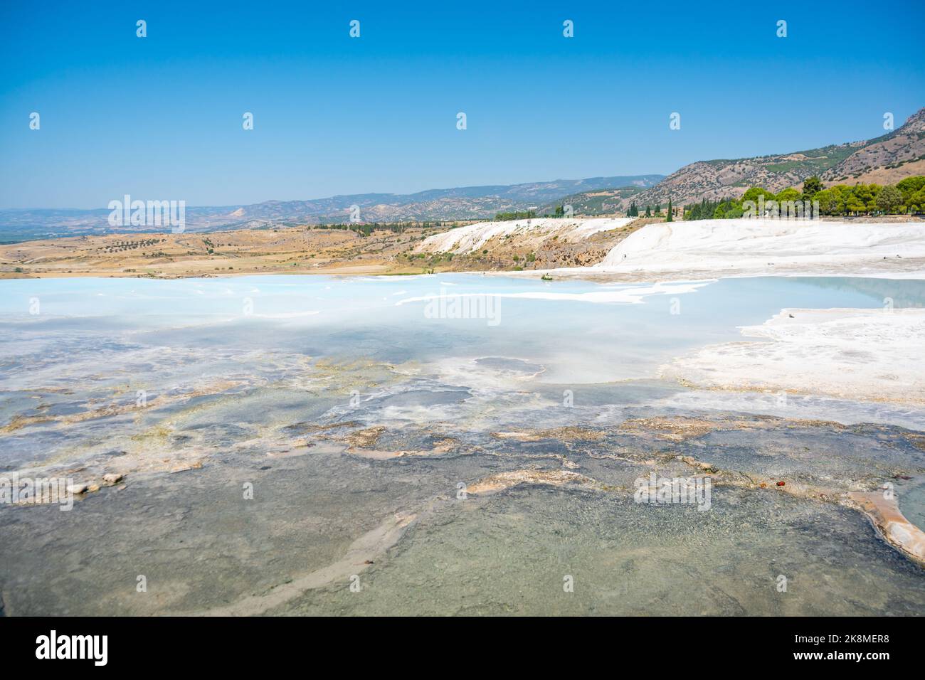 Calcite cliff of Pamukkale, white travertines in Turkey Stock Photo - Alamy