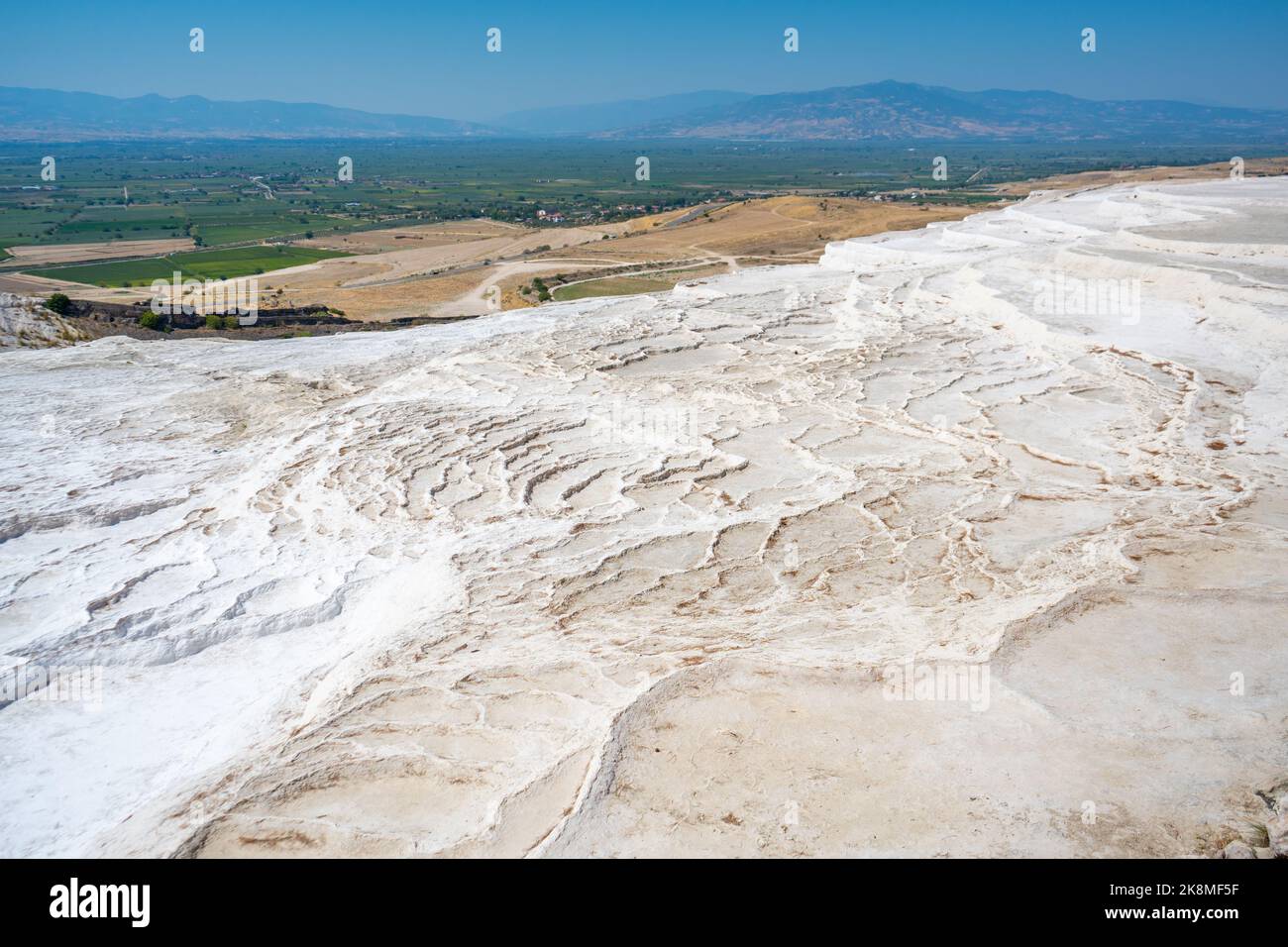 Calcite cliff of Pamukkale, white travertines in Turkey Stock Photo - Alamy