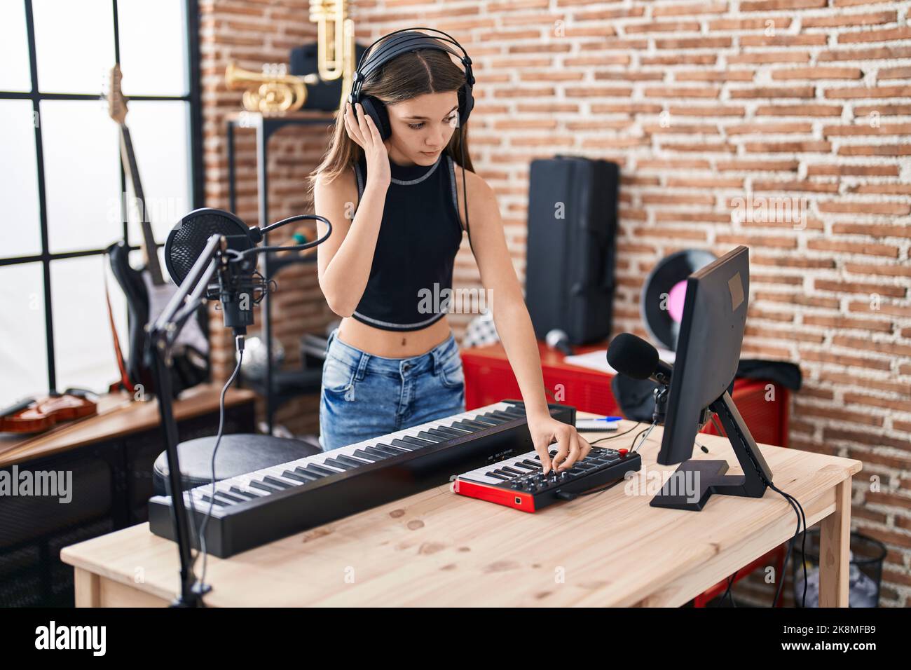 Girl playing keyboard instrument dj hi-res stock photography and images ...