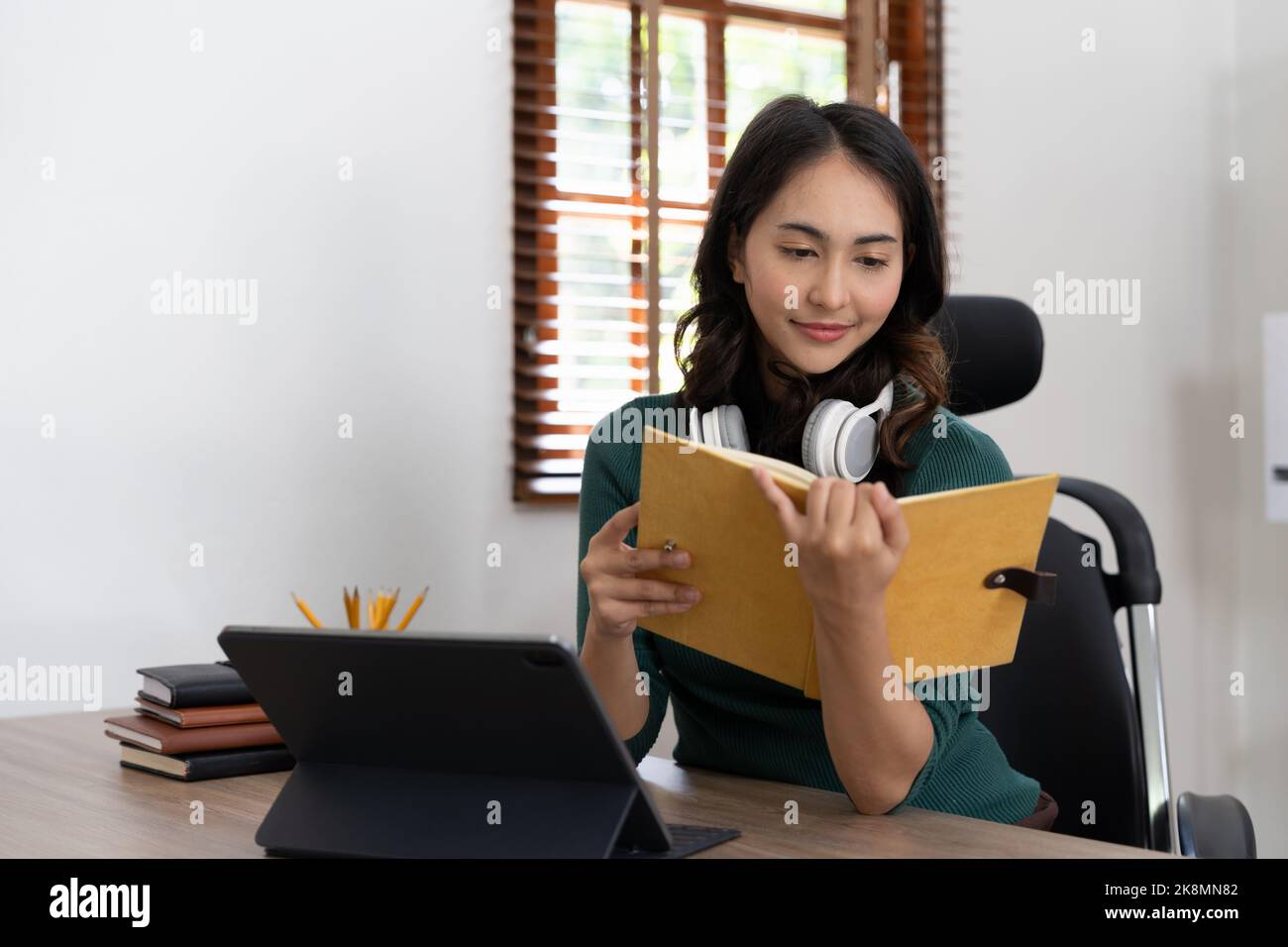 Smiling girl student wear headphone study online with laptop computer ...