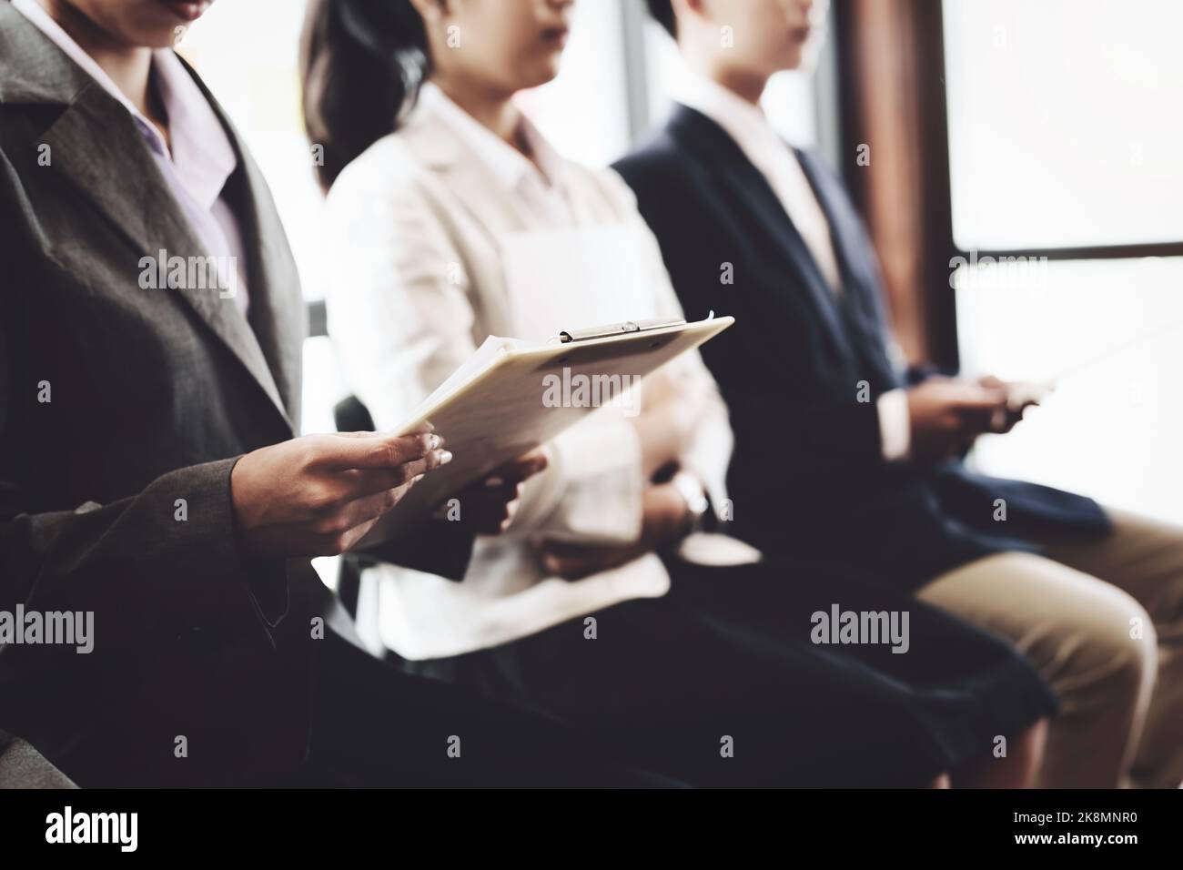 Graduate students holding resume are waiting for an interview job Stock ...