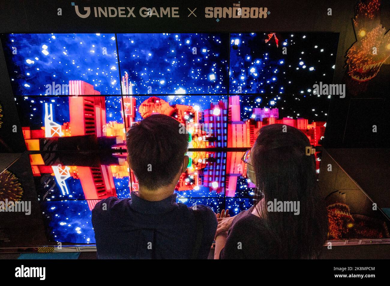 Hong Kong, China. 22nd Oct, 2022. Visitors stand in front of an art installation by Index Game ...