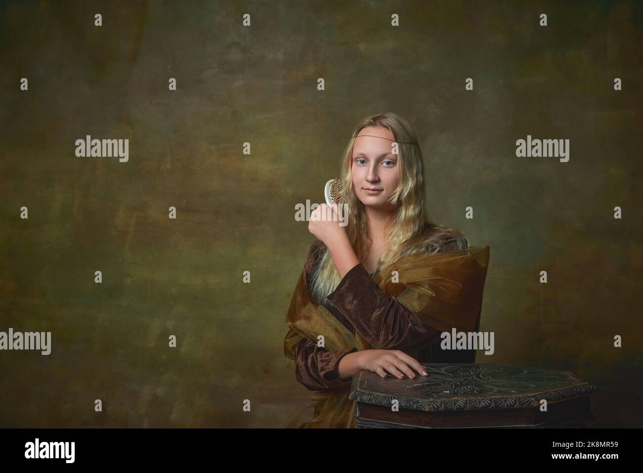 Portrait of young girl as Mona Lisa picture posing over dark vintage ...