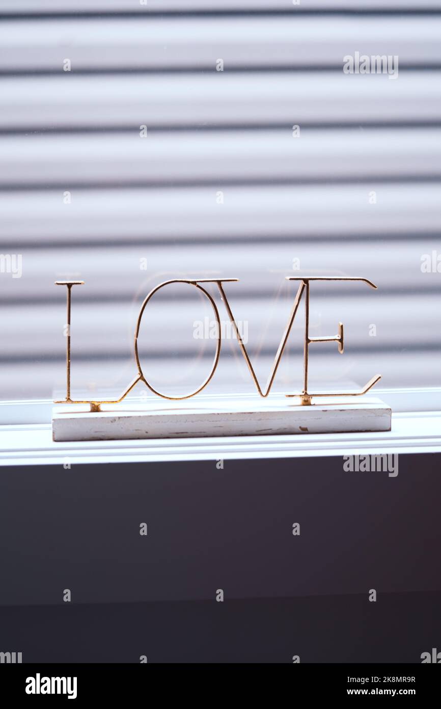 A golden love signage on the window Stock Photo - Alamy